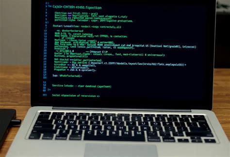laptop screen displaying arbitrary code hackernoon