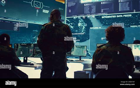 Commander And His Crew Operating Radar Systems Via Cctv And Satellite