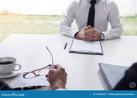 Interviewer Or Board Reading A Resume During A Job Interview Em Stock