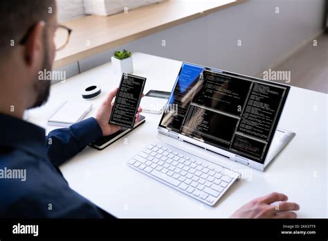 Programmer Or Coder At Office Desk Using Laptop Stock Photo Alamy