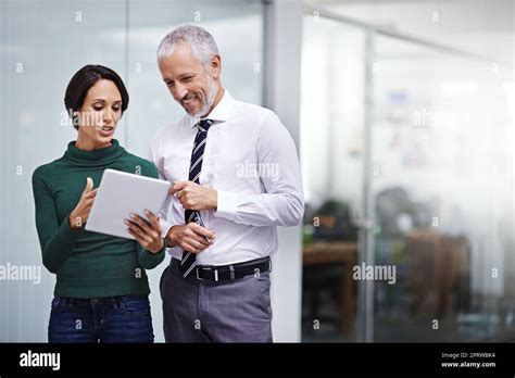 Theyre Both Excited About The New Office Tablet Two Colleagues Looking