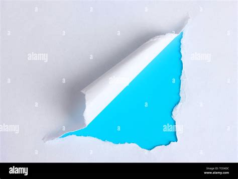 Torn Paper With Blue Background Stock Photo Alamy