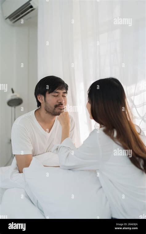 Asian Romantic Couple In Bed Enjoying Sensual Foreplay Happy Sensual Young Couple Lying In Bed