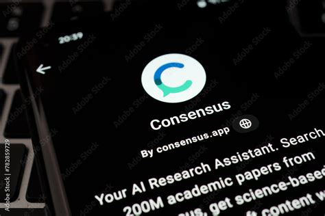 consensus custom gpt seen in gpt store on the screen of smartphone placed on laptop keyboad