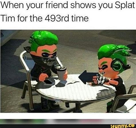 Two People Sitting At A Table With Green Hair And Headphones On One Is