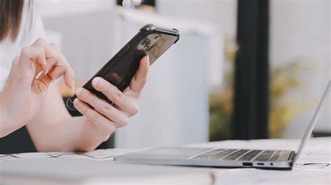 Asian Business Woman Using Calculator And Laptop For Doing Math Finance