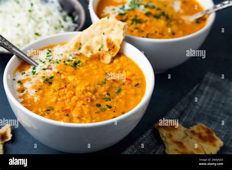 Red Lentil Soup With Coconut Milk And Curry Accompanied By Basmati Rice