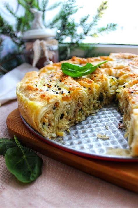 Close Up Of Baked Lasagna In A Ceramic Plate With A Piece Cut Off Stock