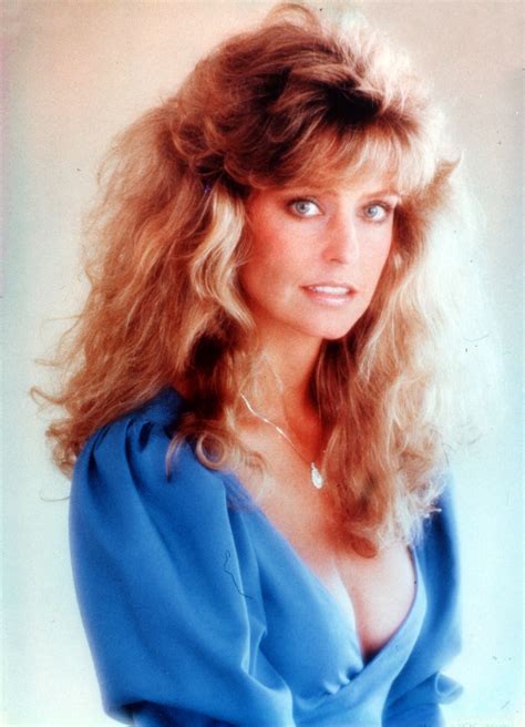 An Autographed Photo Of A Woman With Long Blonde Hair And Blue Dress