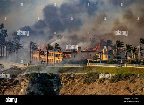 A Wind Driven Brush Fire Burns Hilltop Homes In Laguna Niguel Ca Stock