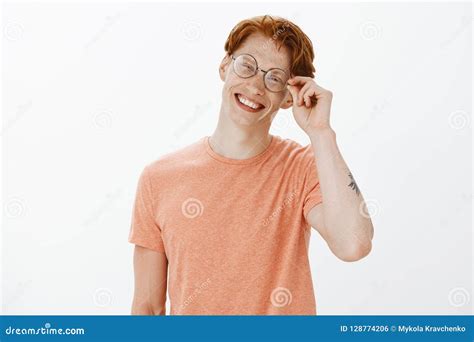 Pleased To Meet You Smart Attractive Redhead Man With Freckles And Tattoos Touching Rim Of