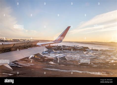 The Plane Is Dressed For Takeoff Aircrafts Wing And Land Seen Through The Illuminator View