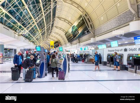 Passengers At Self Check In Machines And The Interior Architecture Of