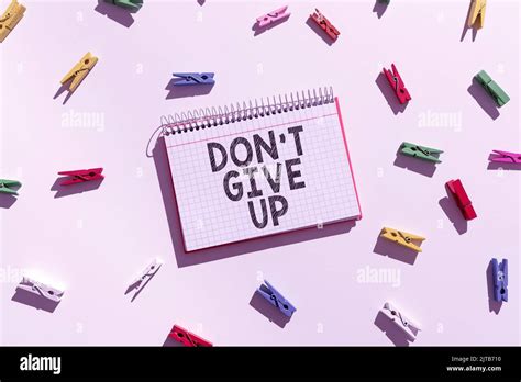 sign displaying don t give up business approach keep trying until you