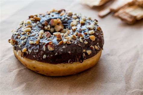 Chocolate Donut With Diced Hazelnut Pieces Stock Image Image Of