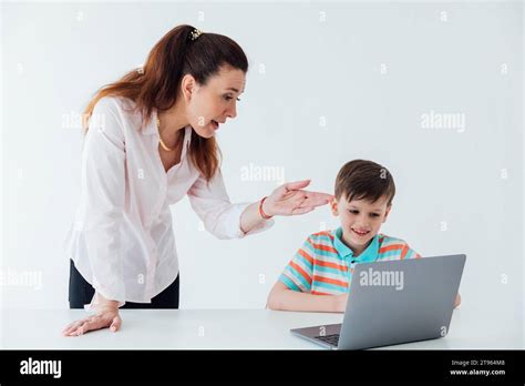 Female Teacher Teaching Babe To Use Computer Stock Photo Alamy