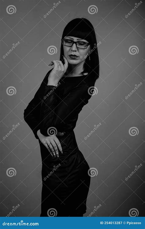 Portrait Of A Beautiful Girl With Glasses Posing For A Photographer In