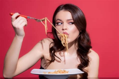 Premium Photo Italian Girl Eating Spaghetti With Fork Bolognese Pasta Food From Italia