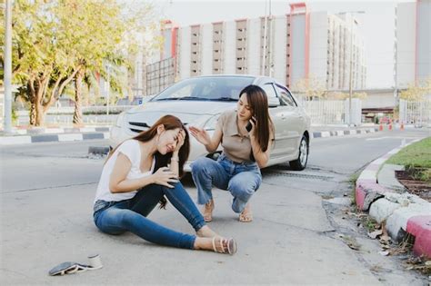 Premium Photo Woman Was Hit Car While Crossing The Road Injured And
