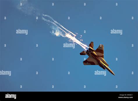Israeli Air Force F 15i Fighter In Flight Emitting Anti Missile Flares