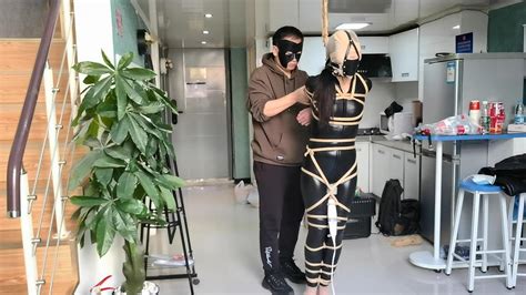 Girl In Black Gel Coat Experiences Orgasm In Full Body Bondagechinese