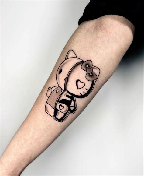 Hello Kitty Tattoo In 2025 Hello Kitty Tattoos Doll Tattoo Voodoo