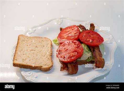 Blt A Bacon Tomato And Lettuce Sandwich Made With Oatnut Bread With A