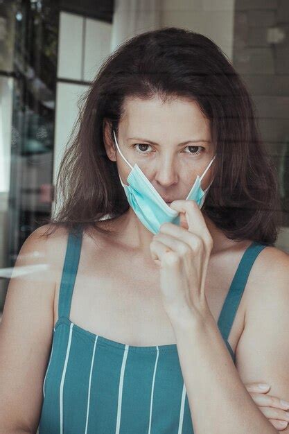 Premium Photo Woman Tired Of Isolation And The Pandemic Takes Off Her