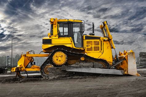 Premium Photo Bulldozer Machine Is Leveling Construction Site