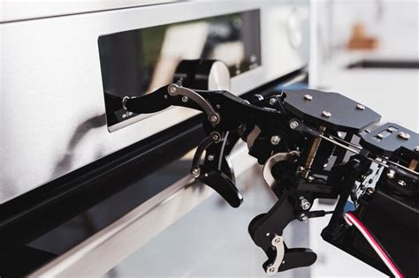 Premium Photo Real Robots Hand And Electric Oven Concept Of Robotic