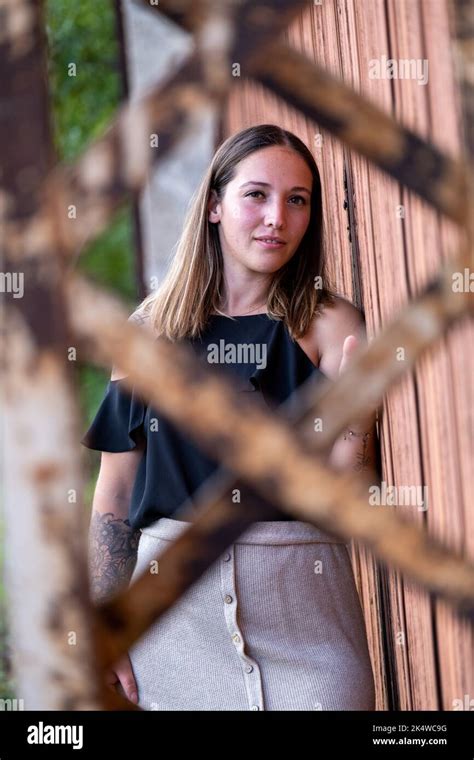 Woman Leaning Against Wall Smiling Hi Res Stock Photography And Images