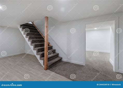 Interior View Of A Staircase In A Renovated Empty Room With White Walls