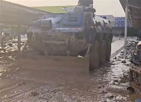 Video Police Deploy Heavy Machinery To Clear Flood Debris At Valencia