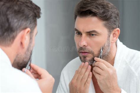Caucasian Man Trying To Make A Hair Cut By Himself With Scissors Male