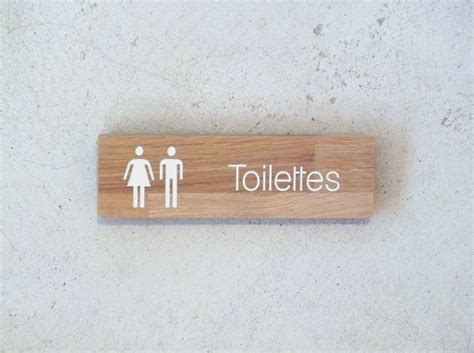 Panneau toilettes avec texte et pictogramme gravés doucine fr