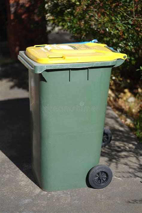 Australian Home Rubbish Bins Set Provided By Local Council On Back Yard In Australian Suburb