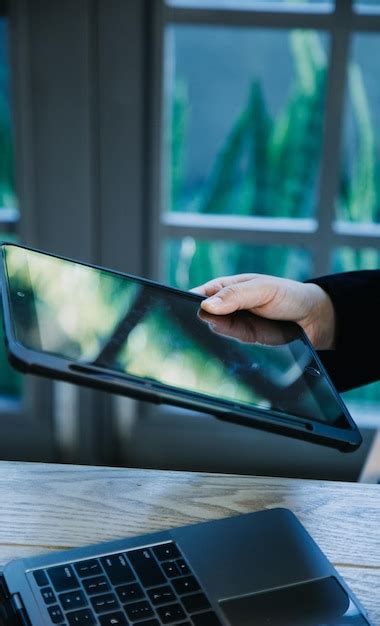 premium photo close up hands multitasking man using tablet laptop and