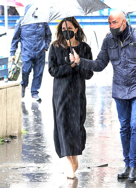 Angelina Jolie Walks Through The Rain In Rome In Heels Photos