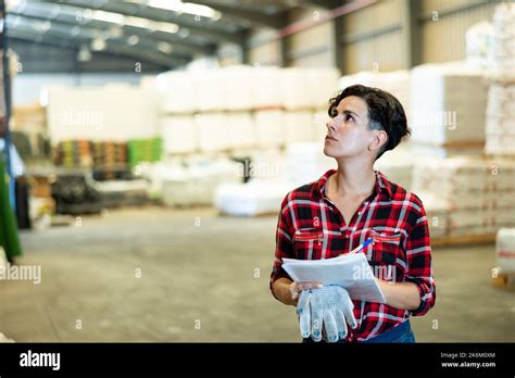 Woman Making Stock Control In Warehouse Stock Photo Alamy
