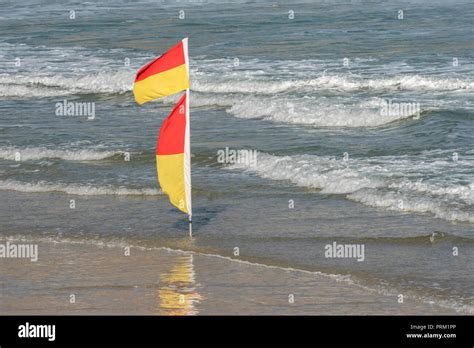 Bathing Flags Only Swim Between Two Yellow And Orange Flags Seaside