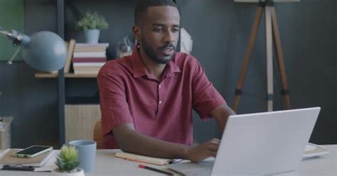 Cheerful Programmer Using Laptop Typing Coding Working With Computer In Office Business