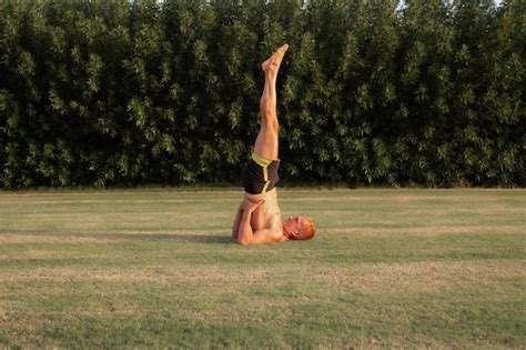 Premium Photo Man Practices Sarvangasana Or Shoulder Stand Yoga Pose