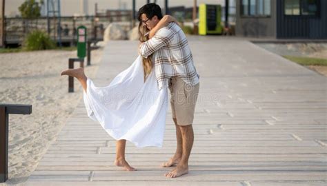 Side View Of Young Couple Hugging In Romantic Position While Standing