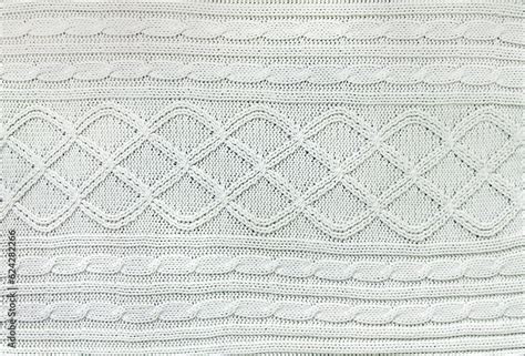 Wool Sweater Texture Of White Color With Cable Knitting Stitch Pattern