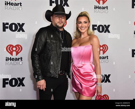 Jason Aldean Left And Brittany Kerr Arrive At The Iheartradio Music