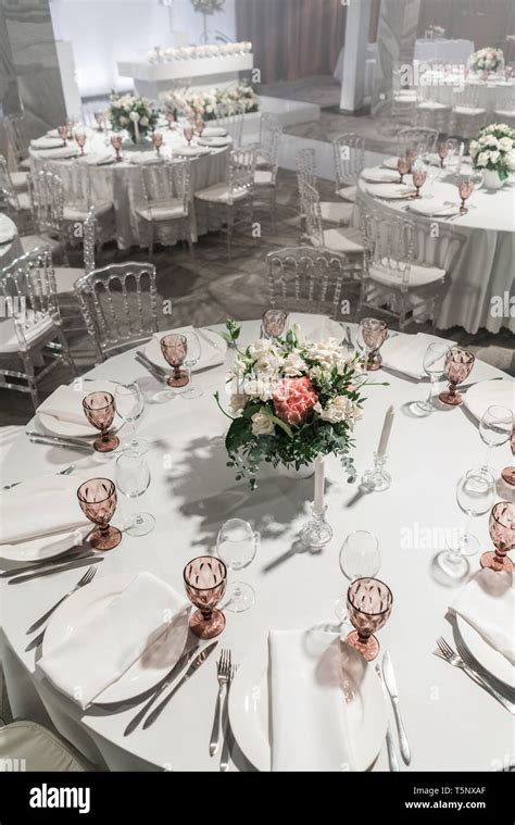Wine Glasses On Round Banquet Table Served Interior Of Restaurant For