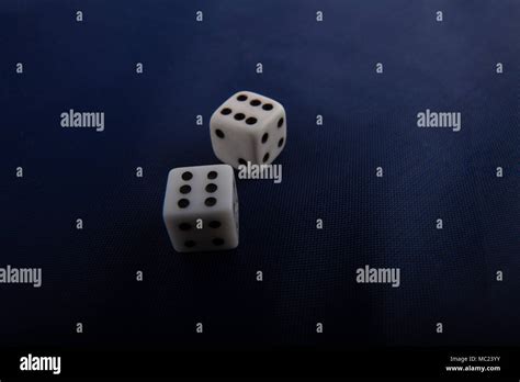 Two White Dice Cubes Showing Six On Blue Background High Angle View