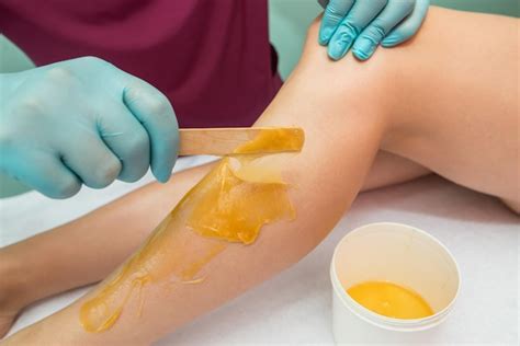 Premium Photo Woman Undergoing Leg Hair Removal Procedure With