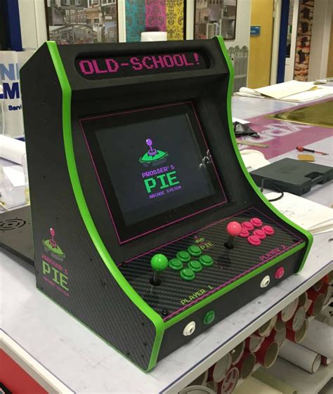 An Old School Computer Game Sitting On Top Of A Table In A Room Filled