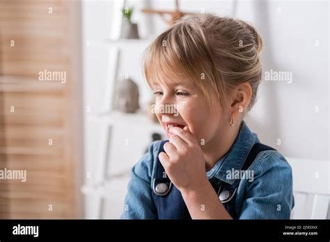 Pupil Touching Mouth During Speech Therapy Lesson In Consulting Room